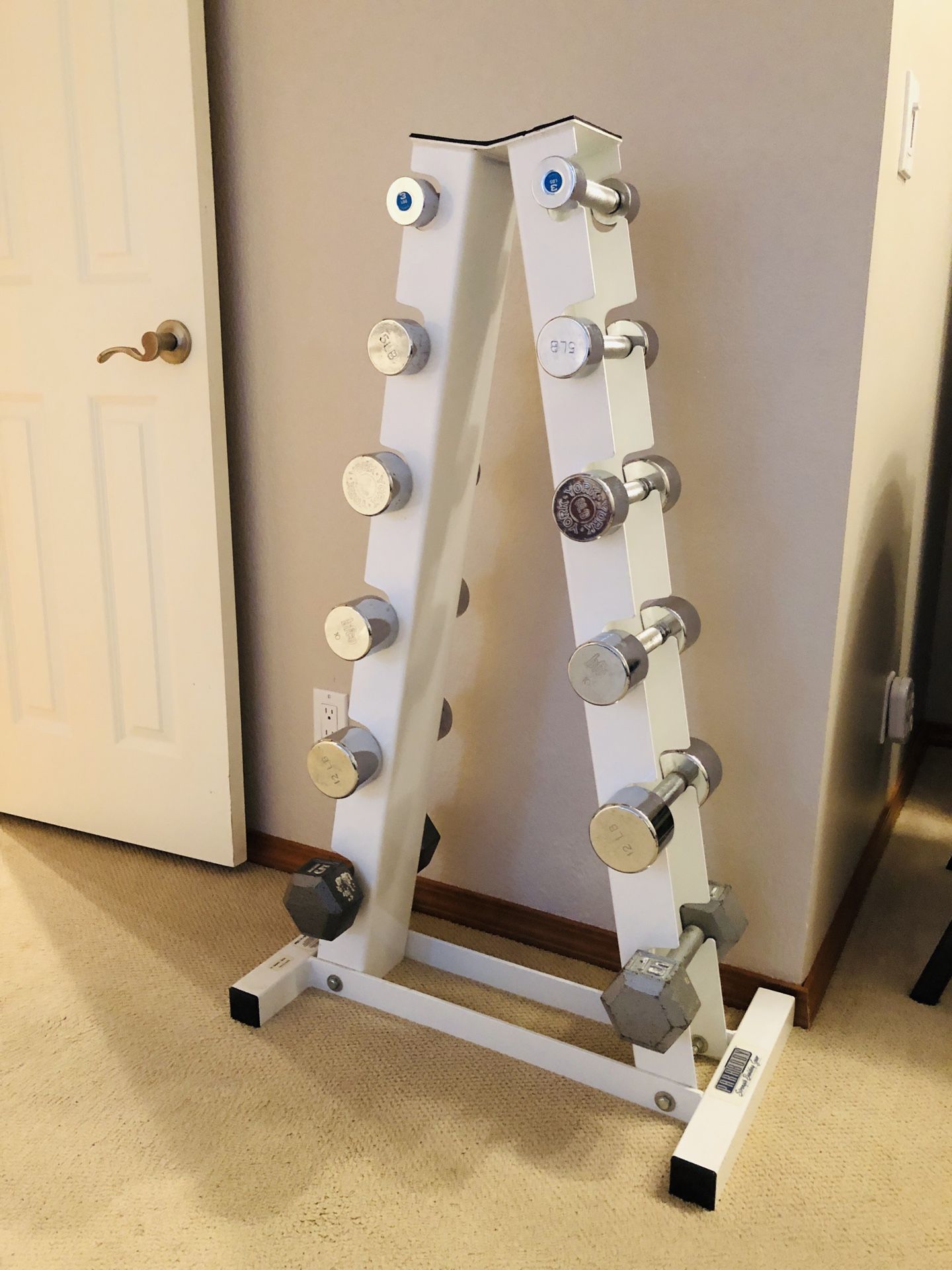 Parabody tower dumbbell rack with 3 to 15 pound weights. All chrome ...