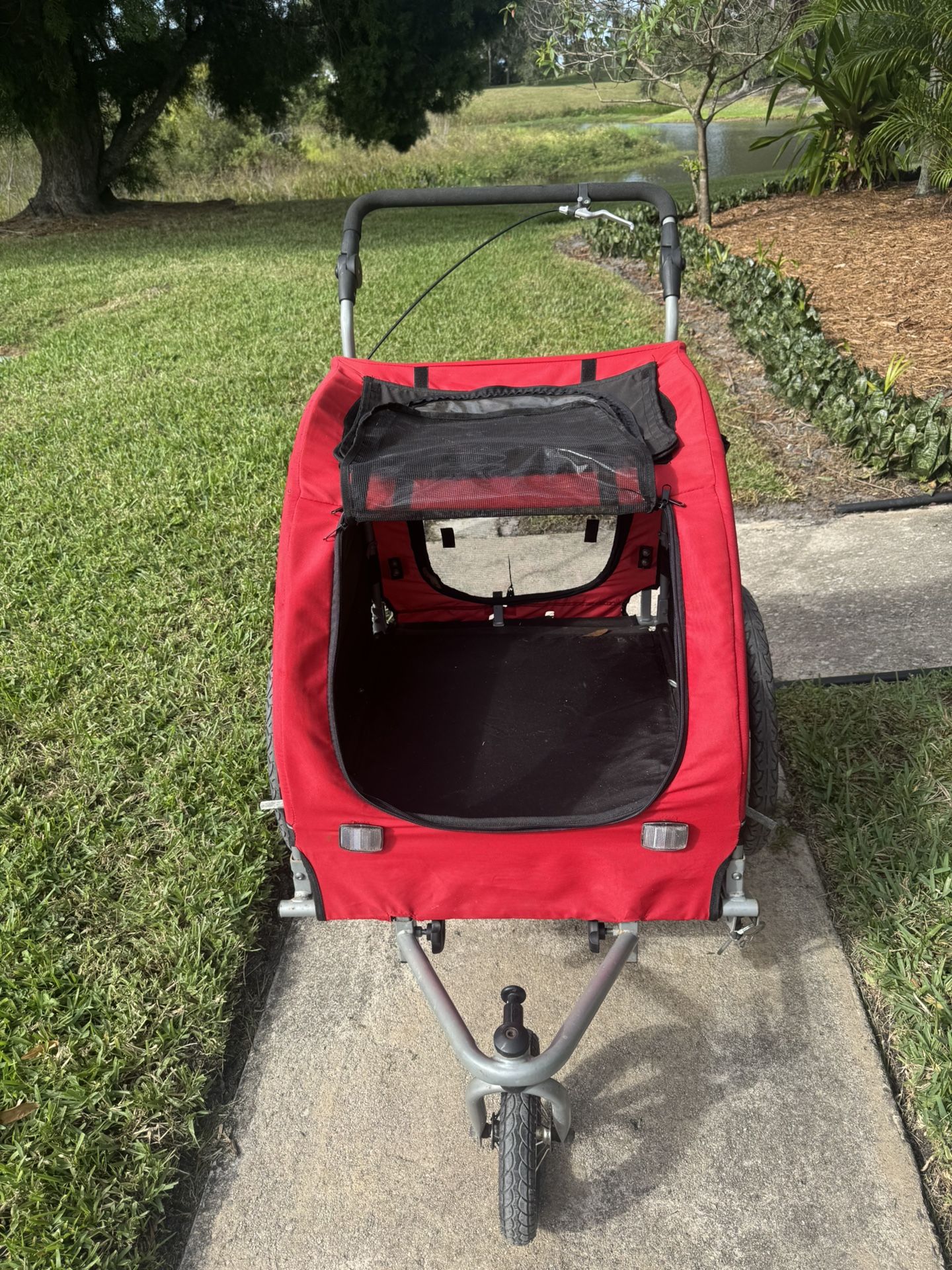 Red stroller/bike trailer for kids/pets. for Sale in Palm City, FL ...