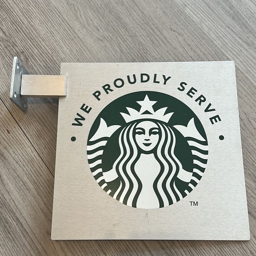 We Proudly Serve Starbucks Logo