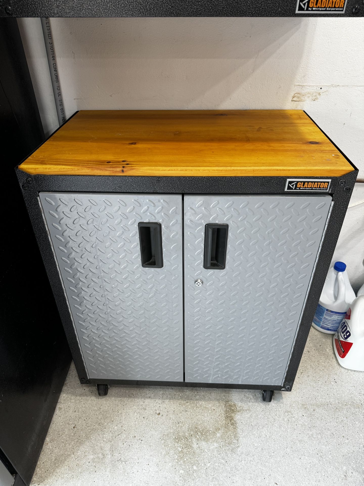 Gladiator Storage Cabinet with wheels and table for Sale in Fort ...
