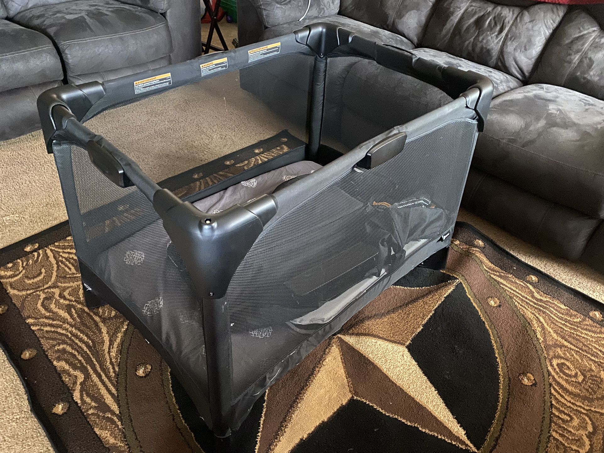 4 moms lightly used foldable crib with changing table for Sale in San ...