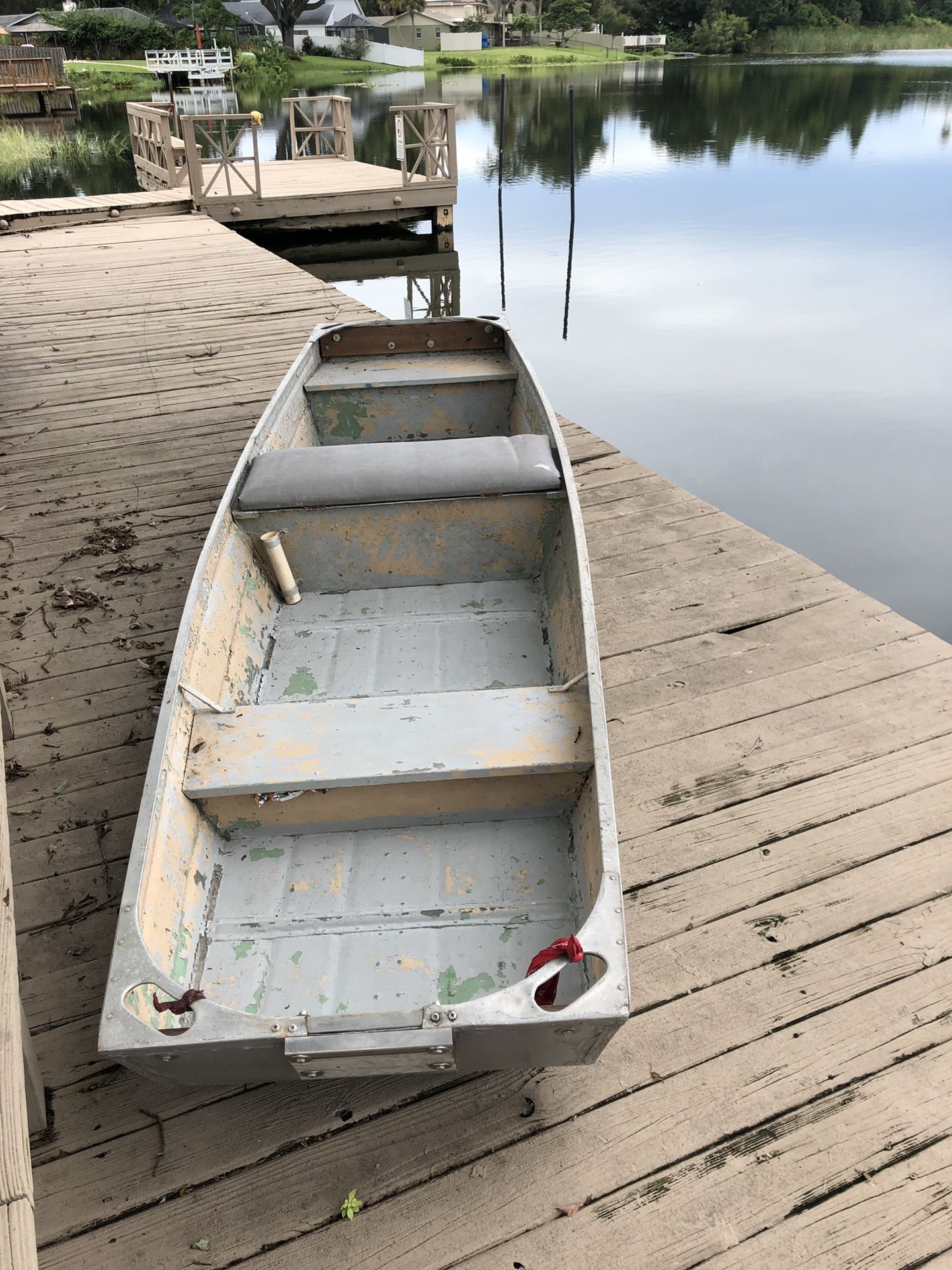 12 foot Jon boat includes two marine batteries and battery charger and ...