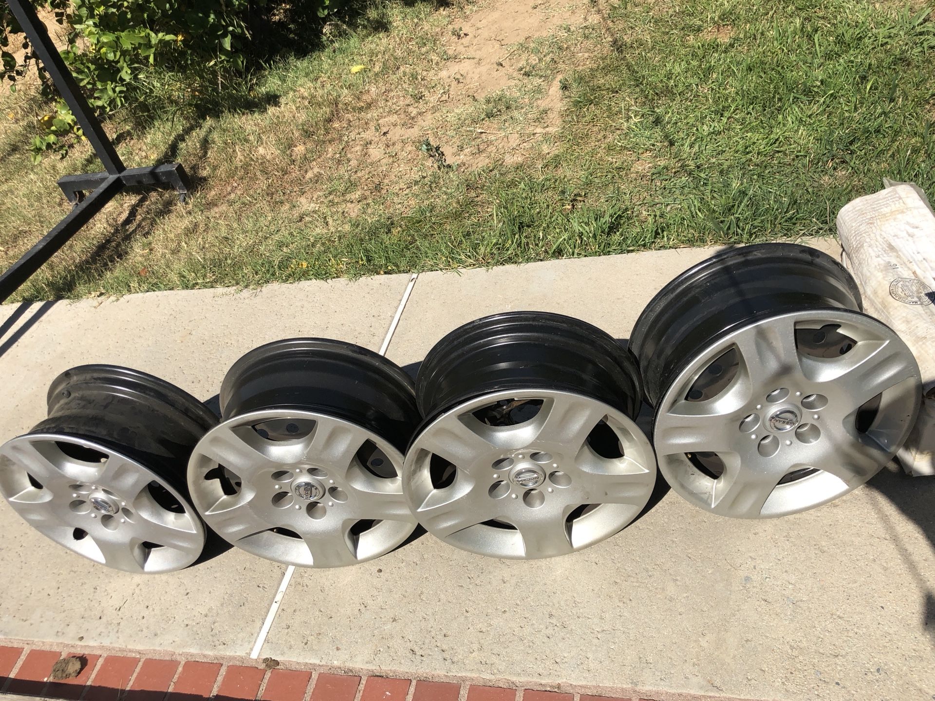 Nissan 5 lug nut pattern wheels and hubcaps set for Sale in Riverside ...