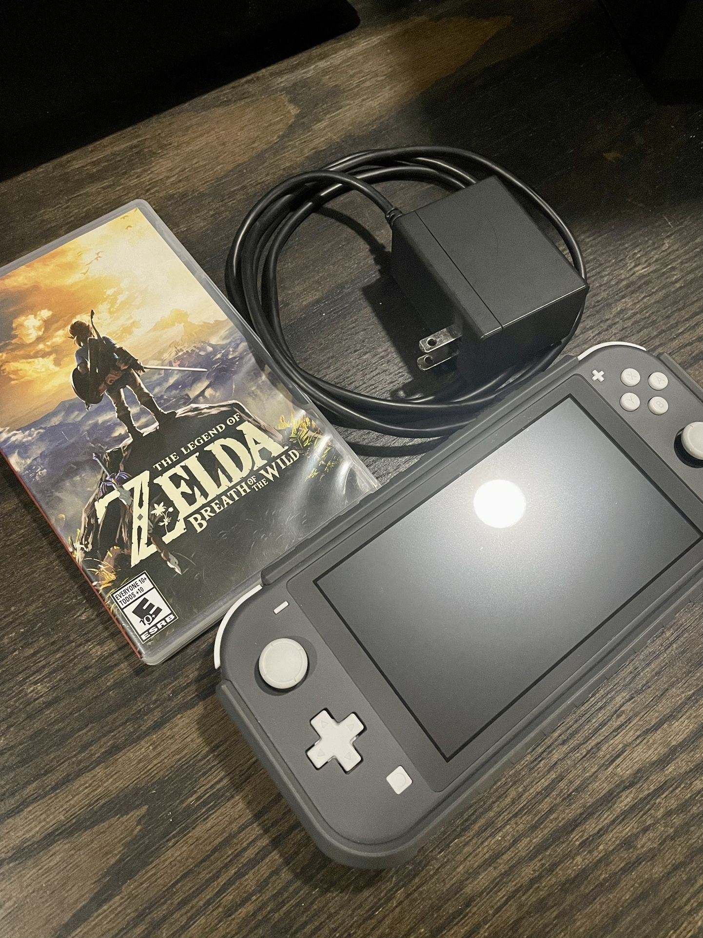 Nintendo Switch Lite Grey with Zelda BoTW and Hard Shell Cover for Sale ...
