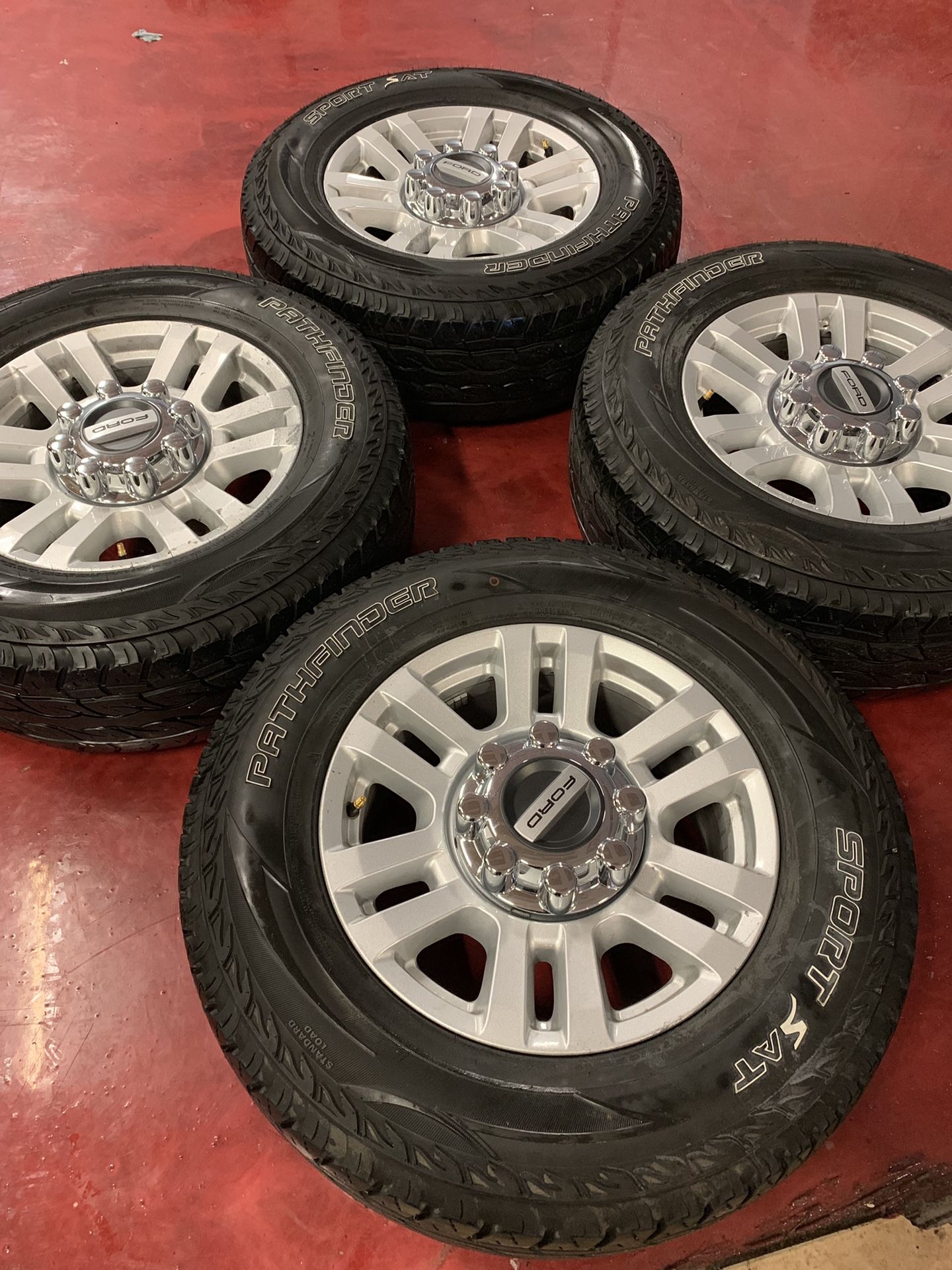 Stock 18 inch 8 lug oem ford wheels with matching 275/65/18 Pathfinders ...