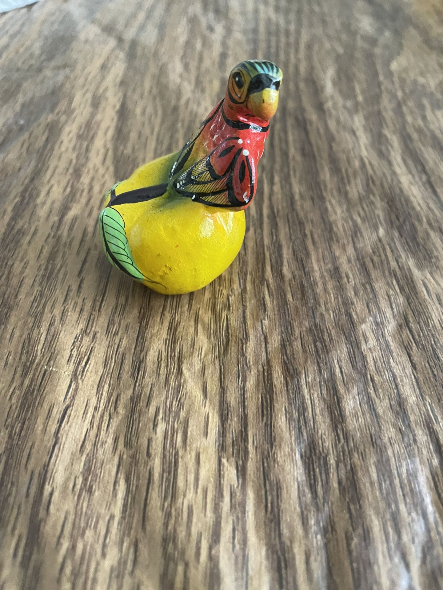 Colorful handcrafted Parrot on lemon figurine- signed & Crafted In ...