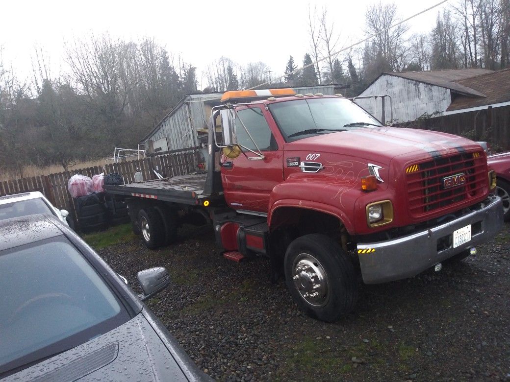 Flatbed tow truck 2000 GMC C-6500 19ft rollback with wheel left, diesel ...