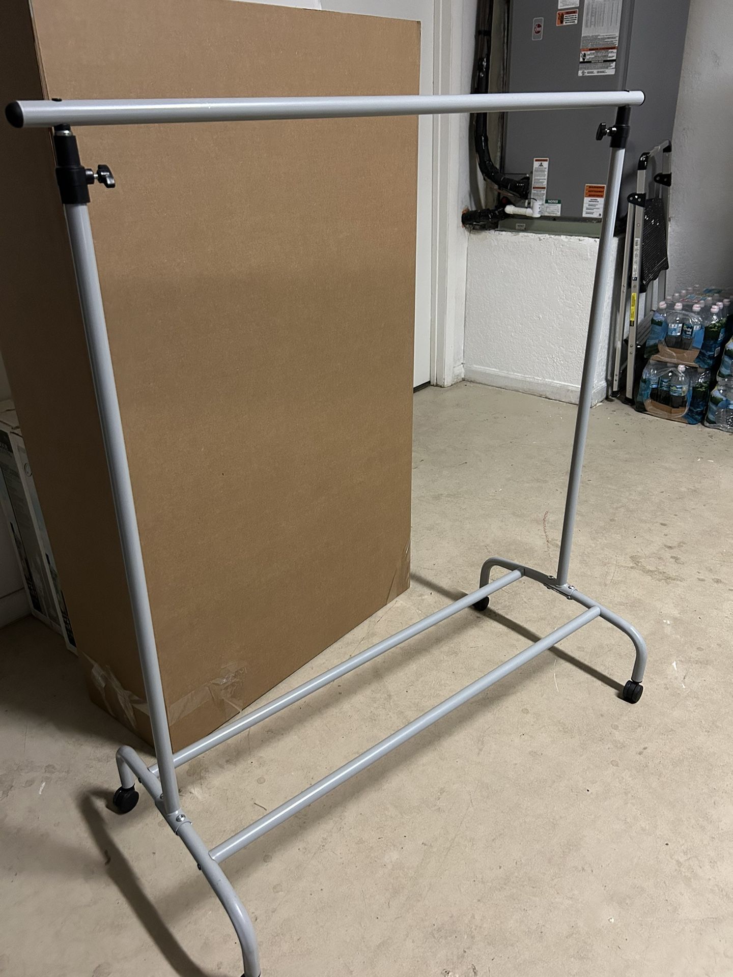 Portable Clothes Rack With Adjustable Height And Wheels for Sale in ...