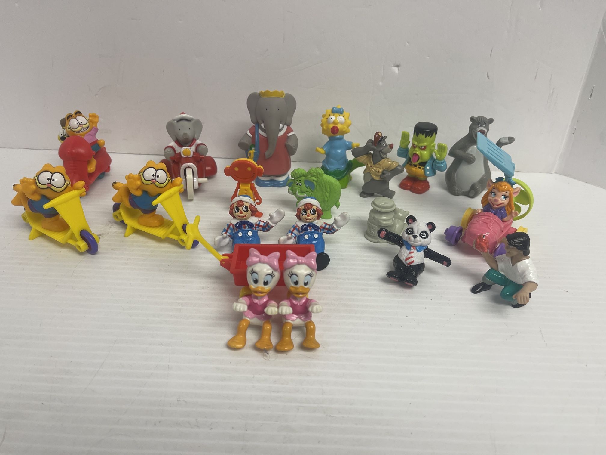 20 Various small characters Disney Arbys Simpsons Garfield elephant ...