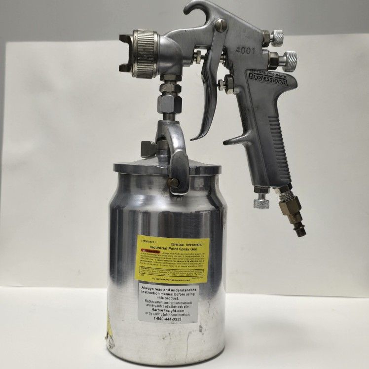 Central Pneumatic #4001 industrial paint spray gun. It is a siphon-feed ...