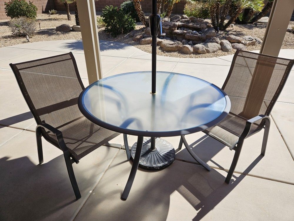 Glass and metal patio table + 2 chairs for Sale in Sun City, AZ - OfferUp