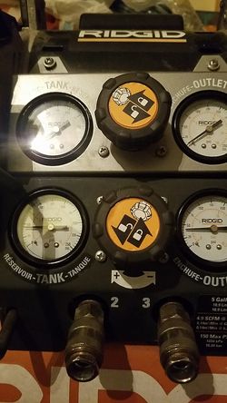Ridgid 5 in 1 dual tank air compressor. Runs like a champ. Has dual ...