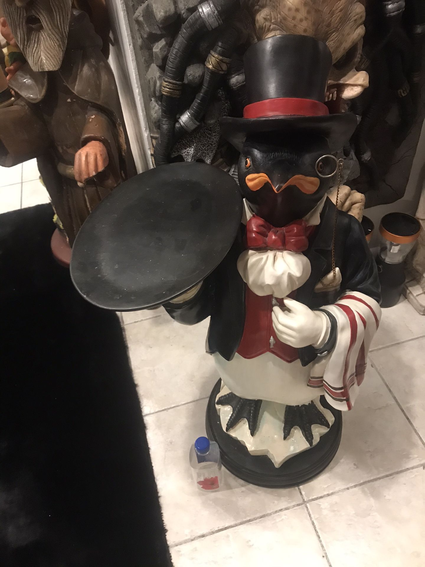 Penguin Butler Statue