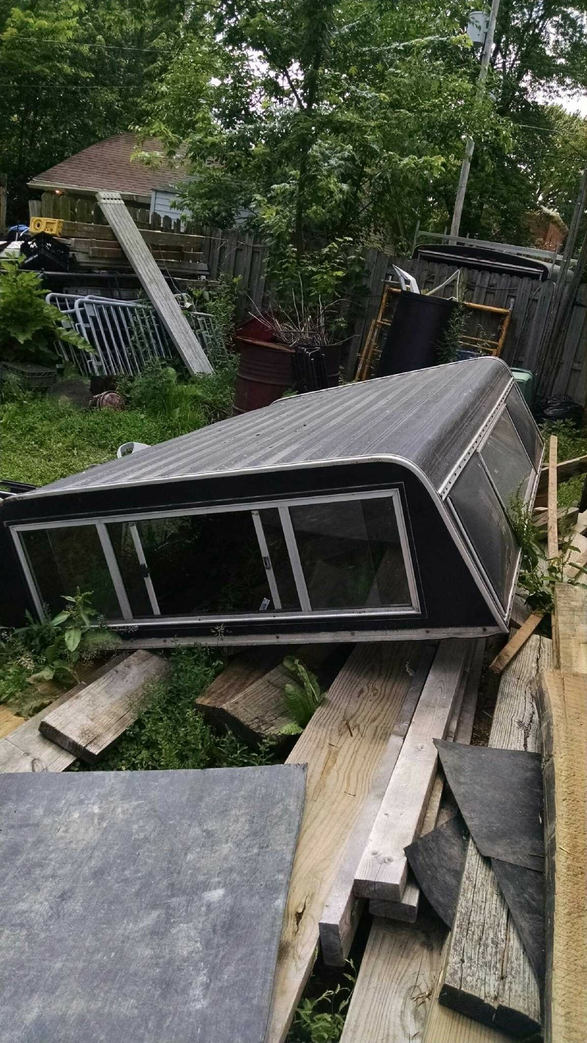 Basic 8 ft camper shell is located at our yard sale right now.$50. for ...