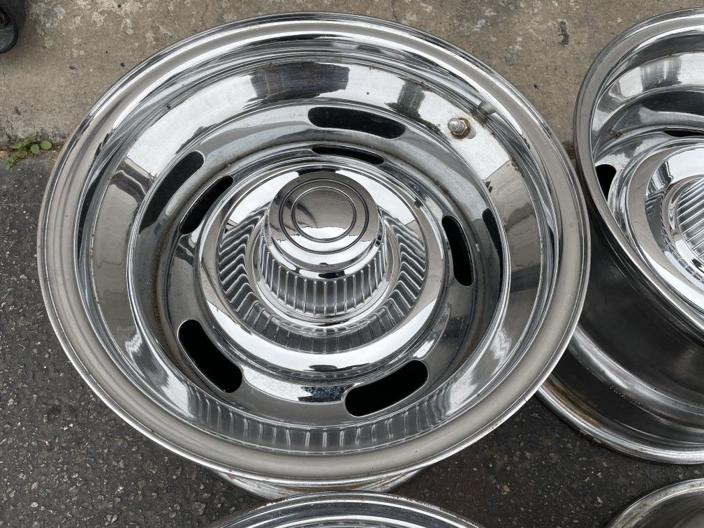 Staggered 15 inch chrome rally rims with caps. 5 lugs. 15x8 and 15x10 ...