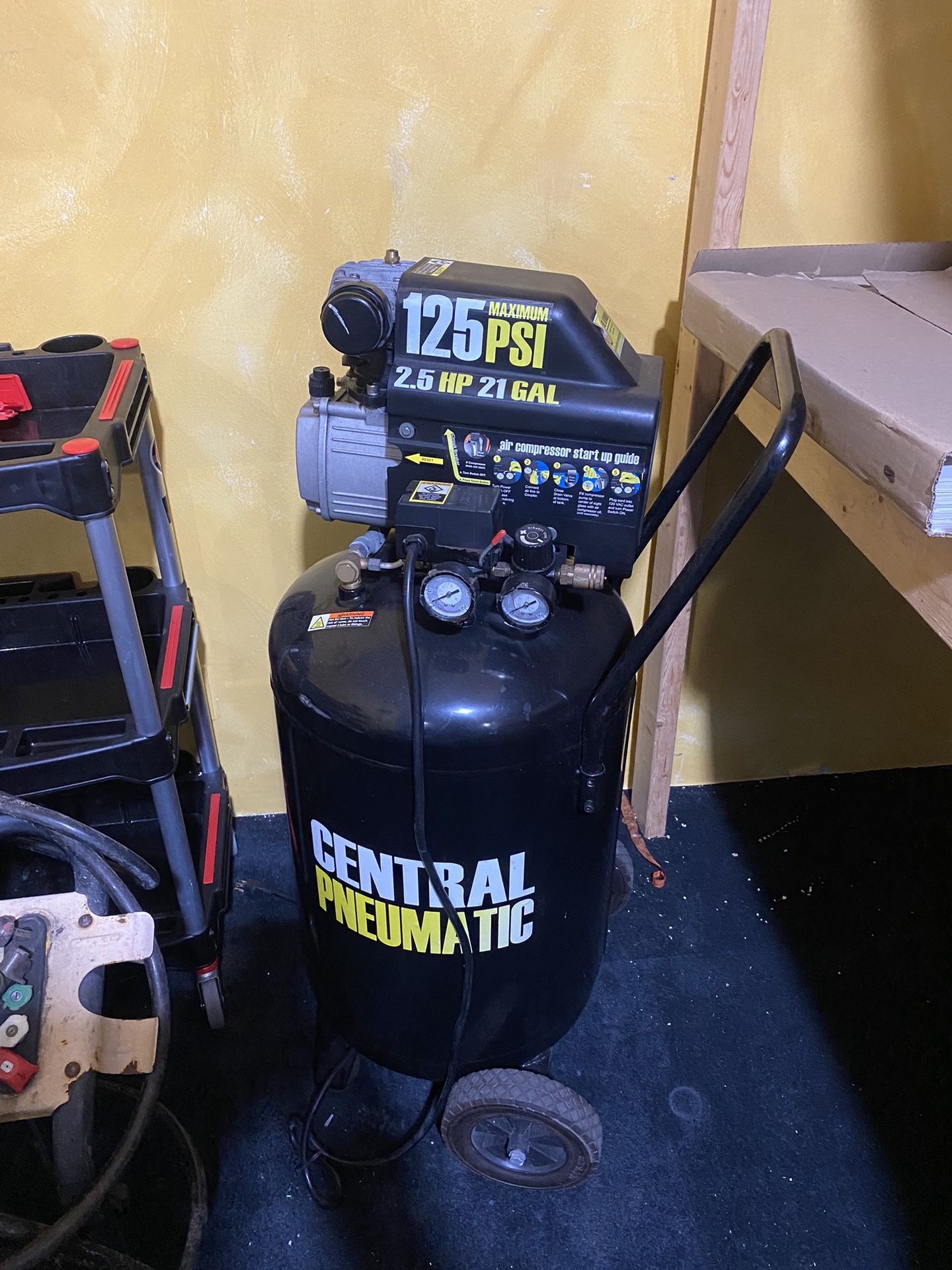 Sold At Auction: Central Pneumatic Air Compressor W/ Hose