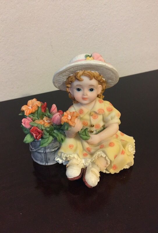 Montefiori Collection Italy design girl sitting holding flowers for ...