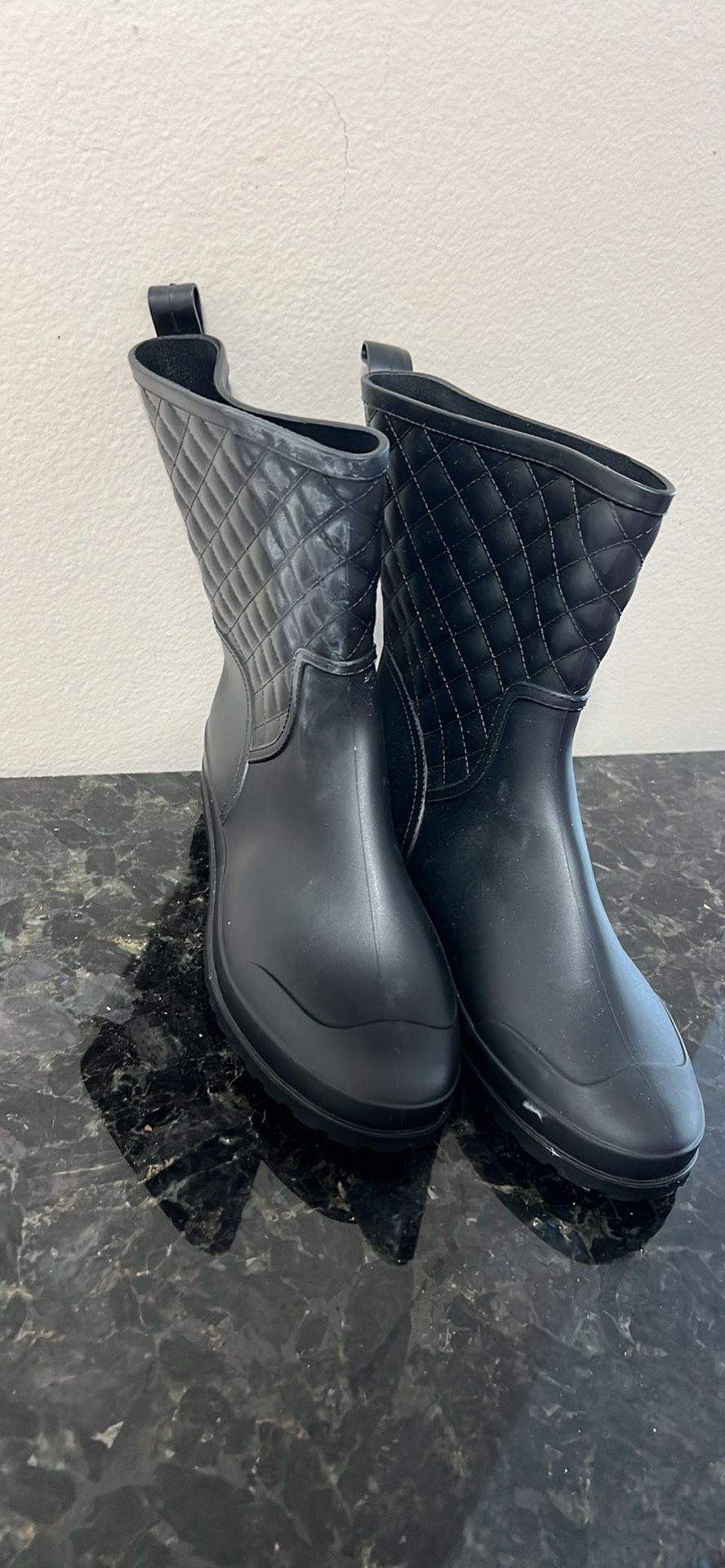 a pair of black, mid-calf, quilted rubber rain boots. for Sale in Palm ...