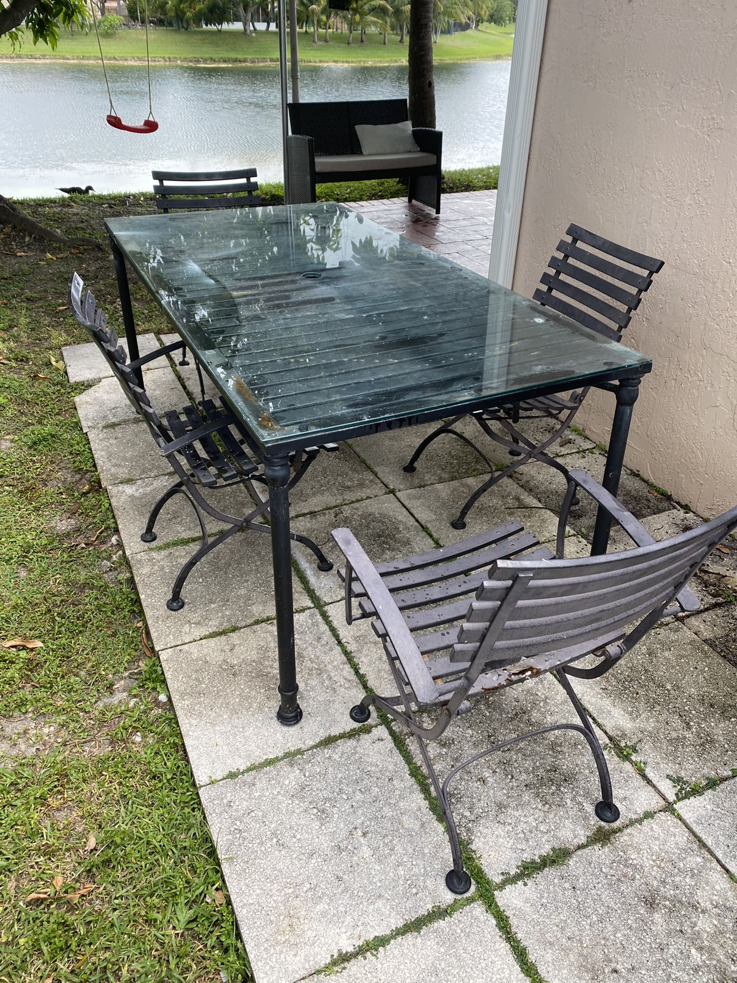 Heavy metal patio table and 4 chairs for Sale in Miami, FL - OfferUp