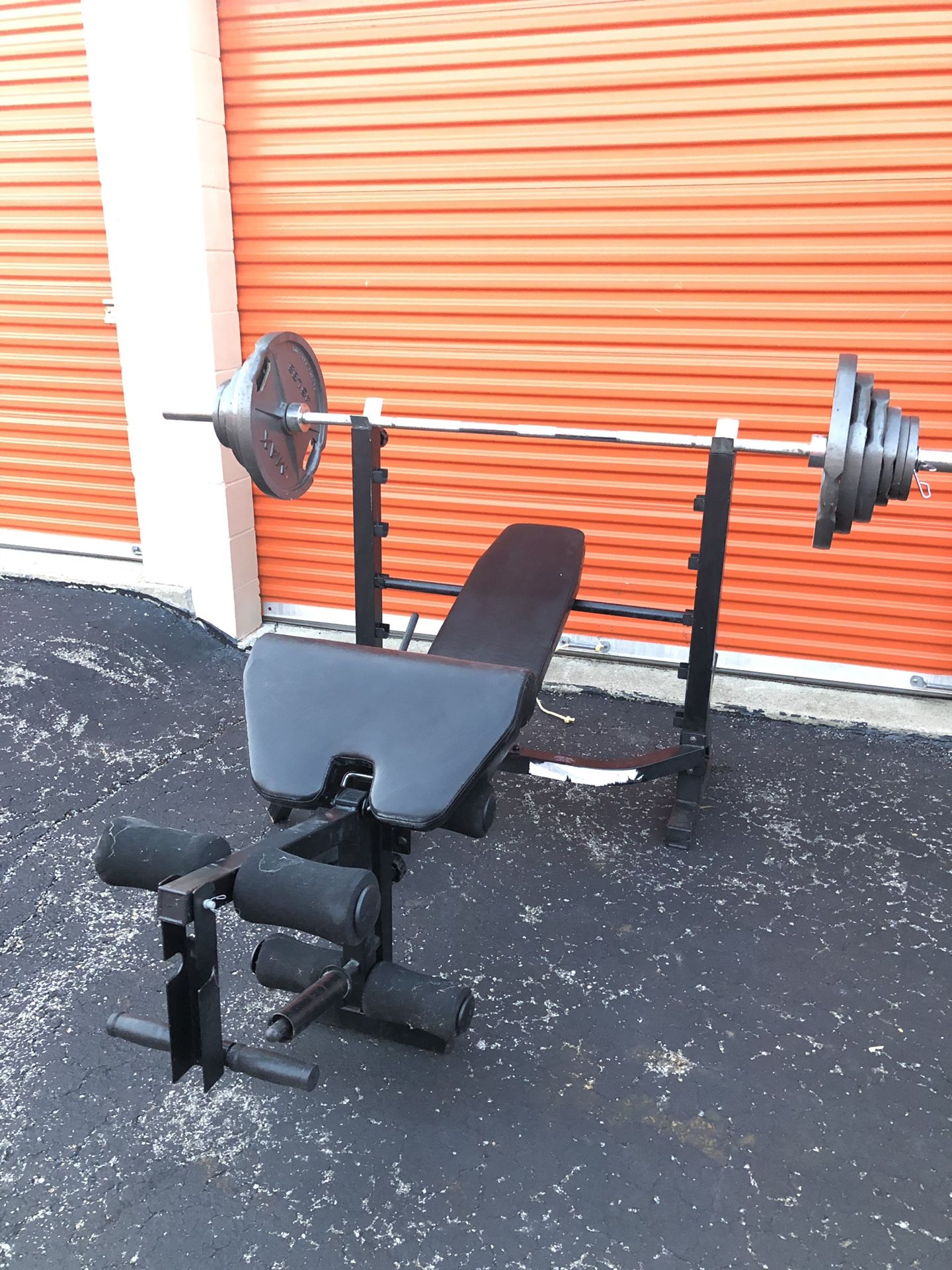 Bench, 250 lbs of Olympic weights, 45 lb Olympic bar for Sale in ...