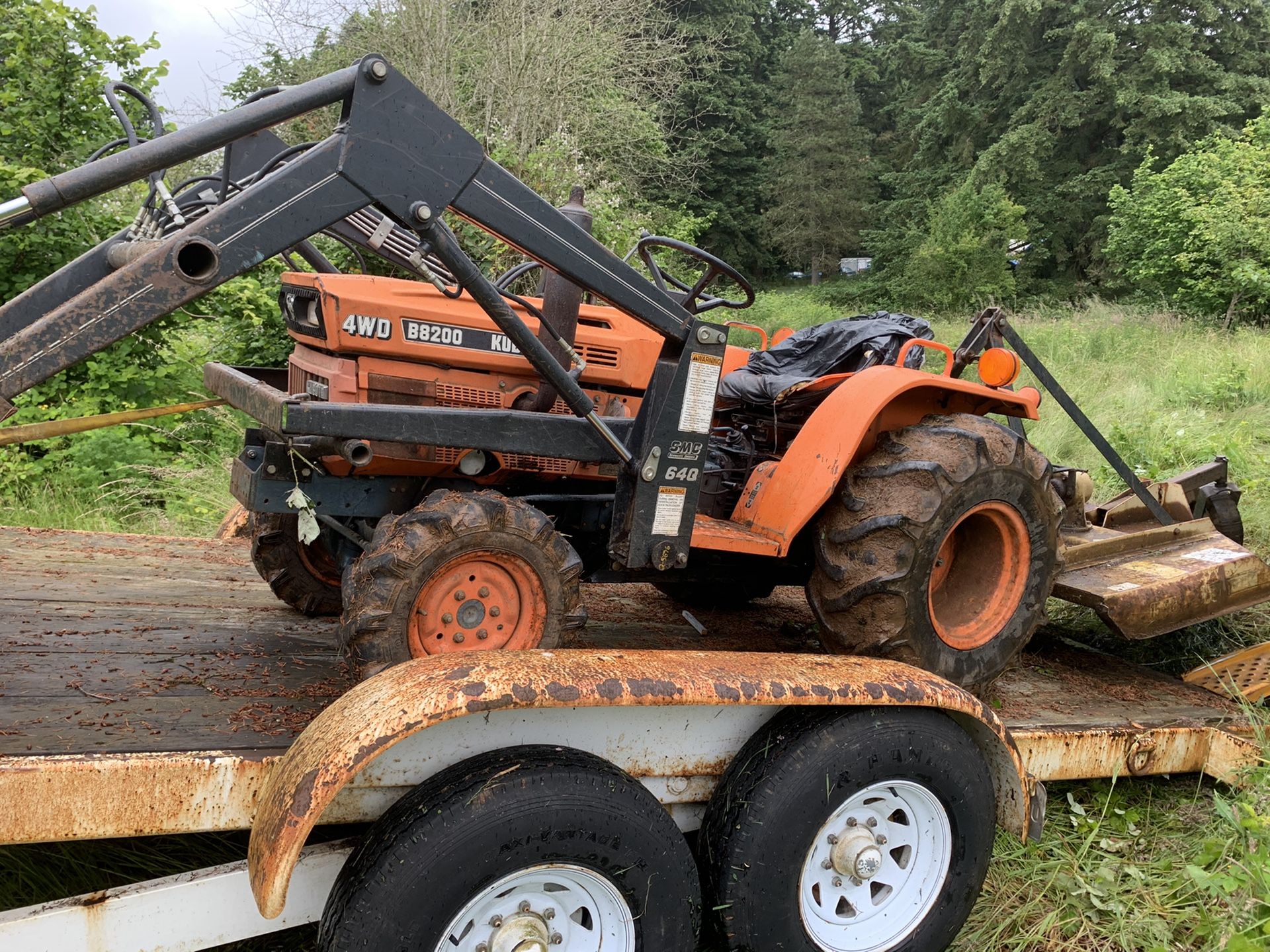 Kubota diesel three cylinder four-wheel-drive tractor with PTO loader ...