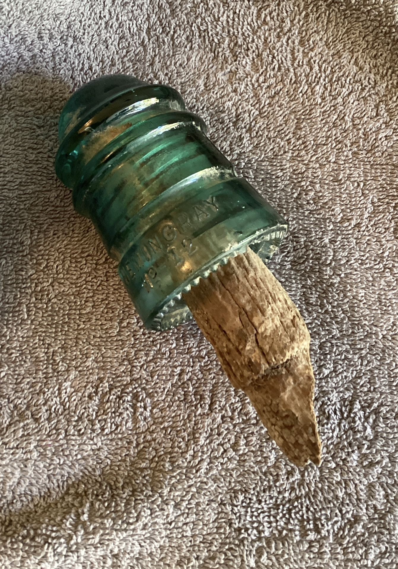 Green Glass Insulator With Piece Of Wood Stuck In It for Sale in Tampa ...