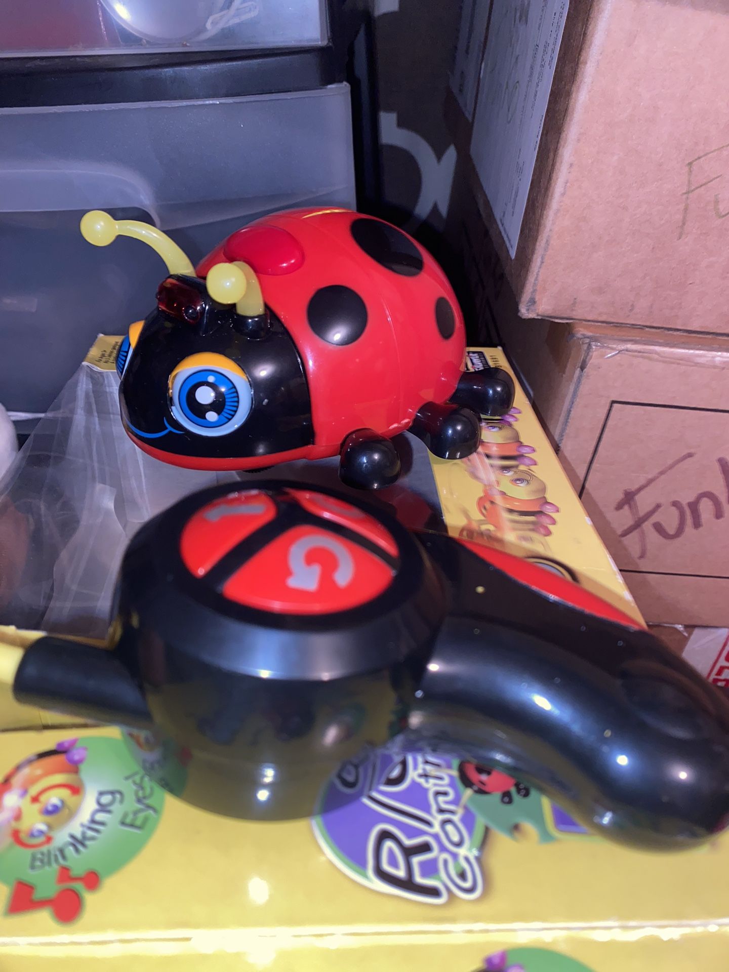 Silverlit ladybug on wheels follows light of flashlight, sounds ...