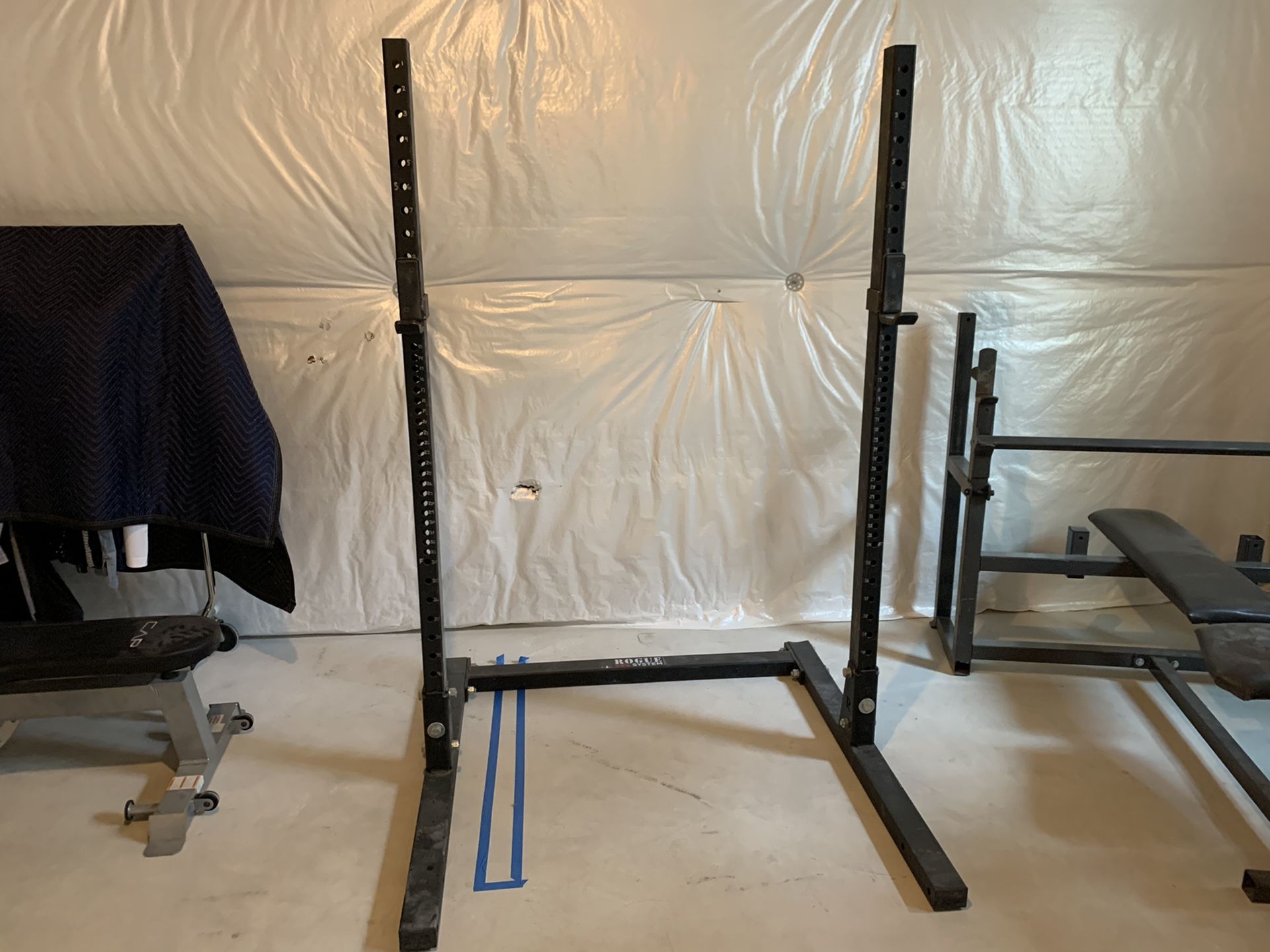 Rogue squat rack with dumbbells up to 80 lbs. bench press rack with bar ...