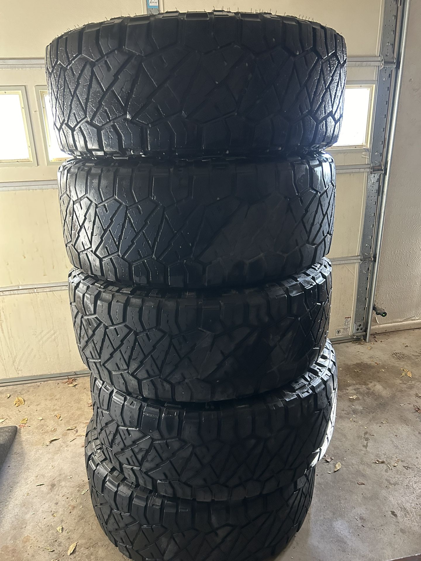 A Set Of Tires And The Extra Tire The Size Of Them Is 35/12.50.R20LT ...