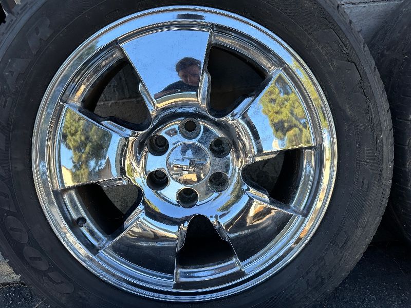 Chevy or GMC truck chrome 20 inch stock 6 lug rims with old tires ...