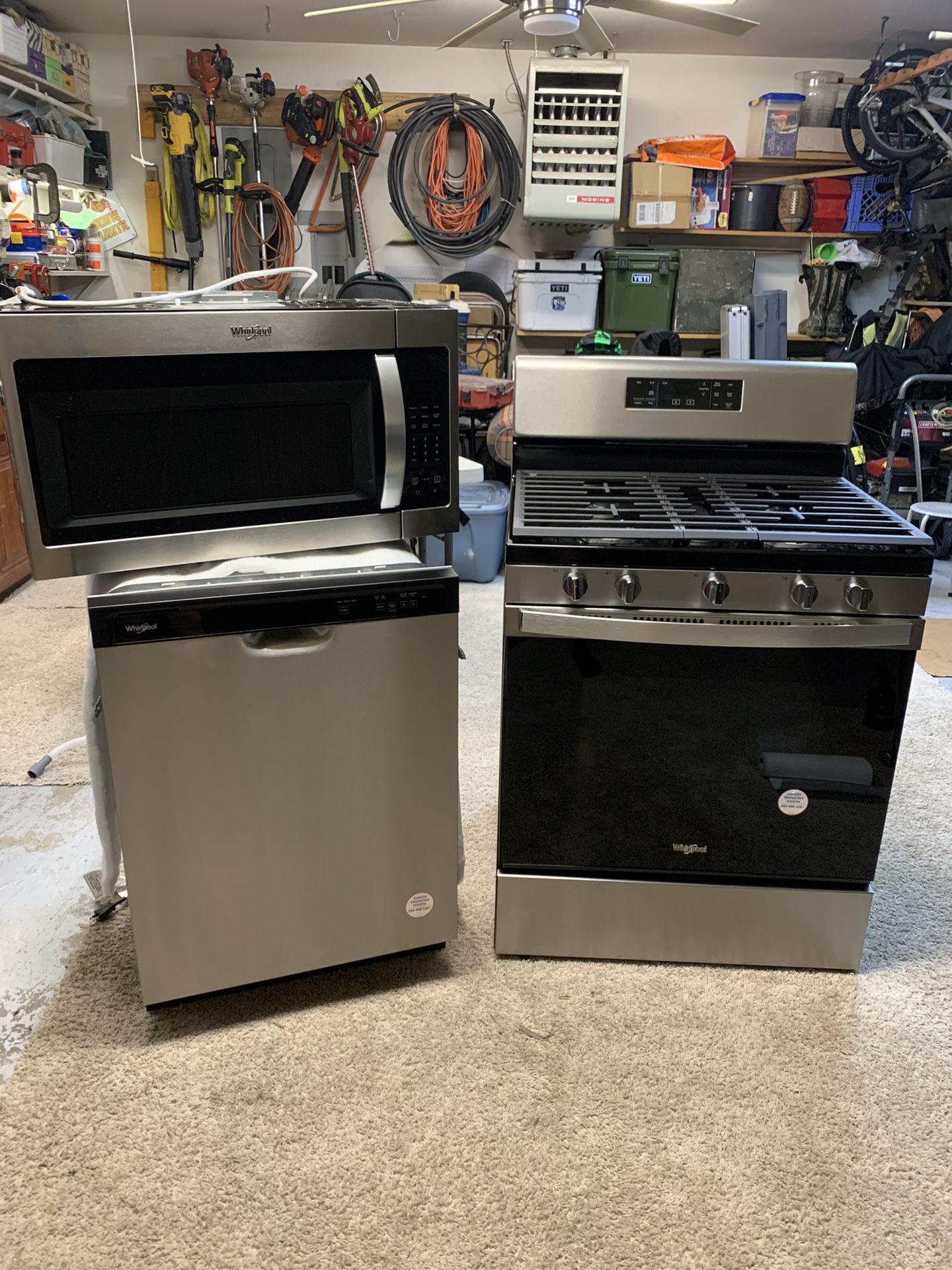 Whirlpool appliances: gas range, microwave, and dishwasher (barley used ...