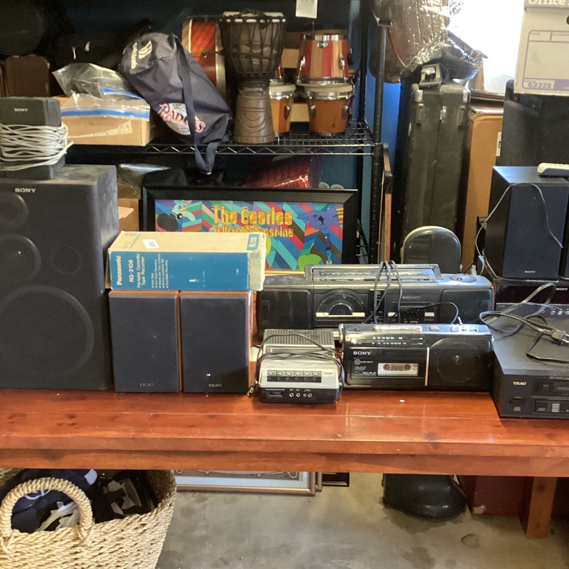 Table Full Of Old Audio Equipment. Radios, Speakers, Tape Players ...