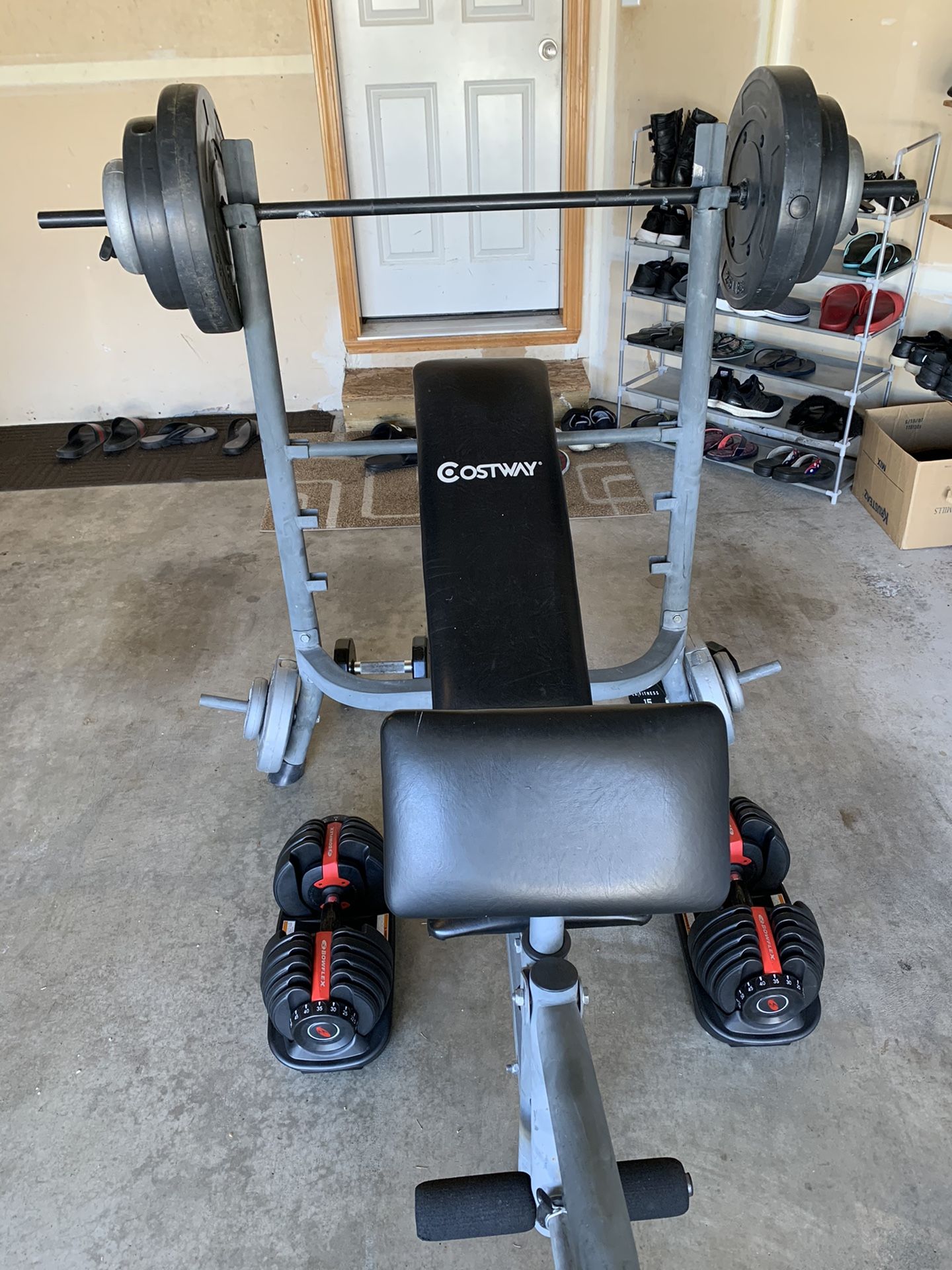 Bench press with weights. (Bowflex dumbbells NOT included) for Sale in ...