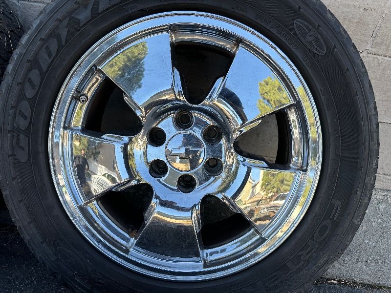 Chevy or GMC truck chrome 20 inch stock 6 lug rims with old tires ...