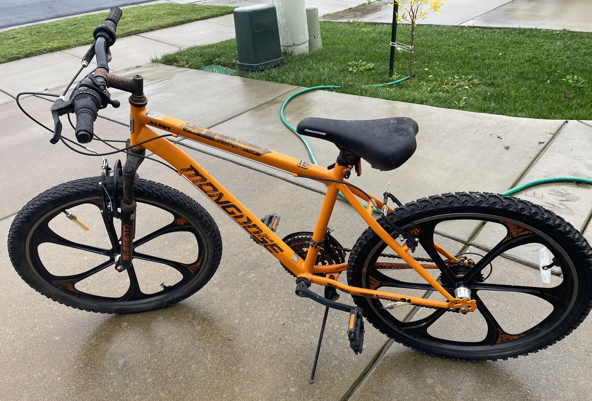 Orange Mongoose mountain bike with black wheels. for Sale in West ...