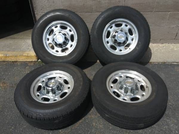 Stock aluminum 16 inch 8 lug chevy rims, caps, and tires for Sale in ...