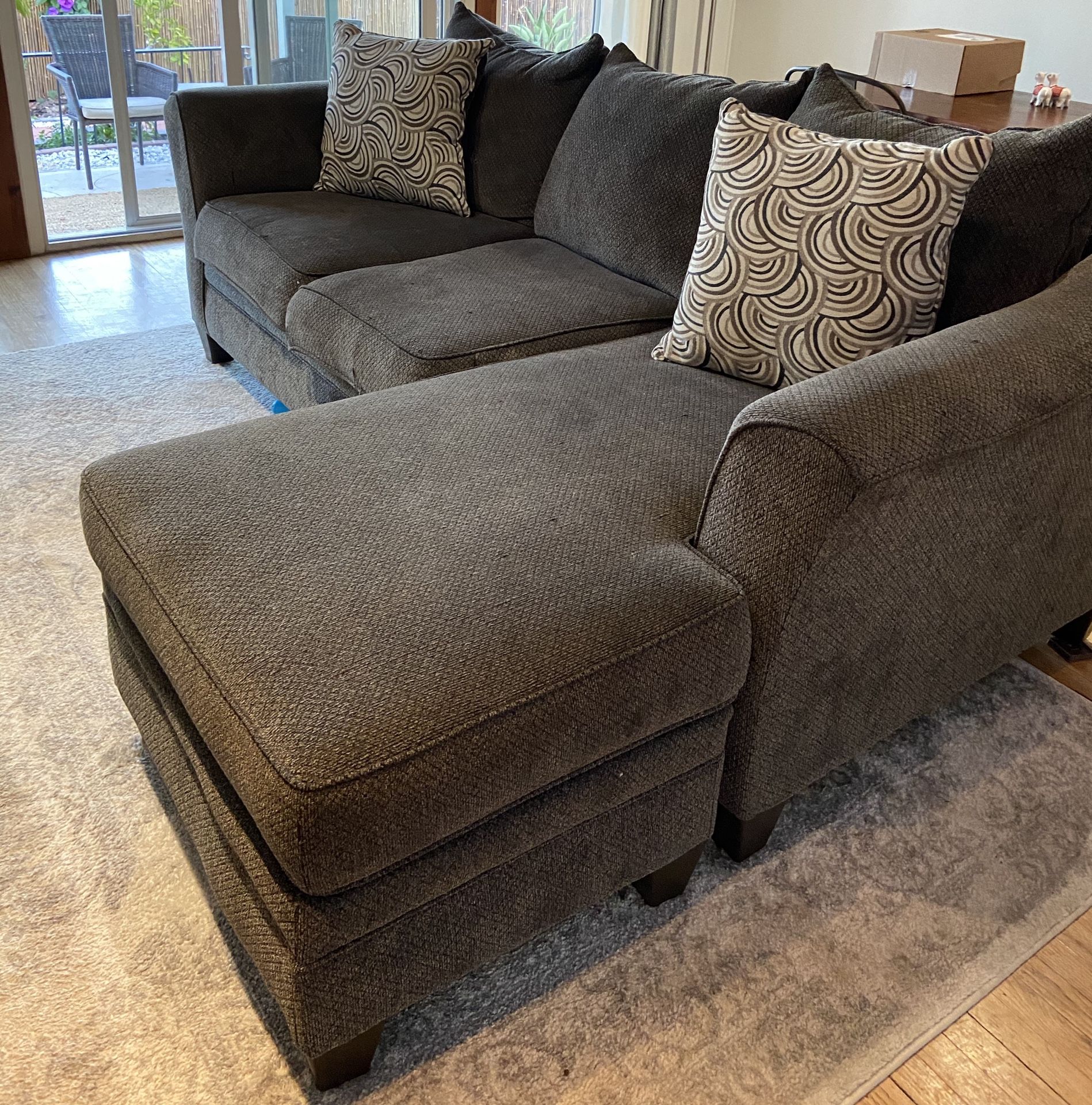 Large 2 piece Grey upholstery couch with built in ottoman- no damage or ...