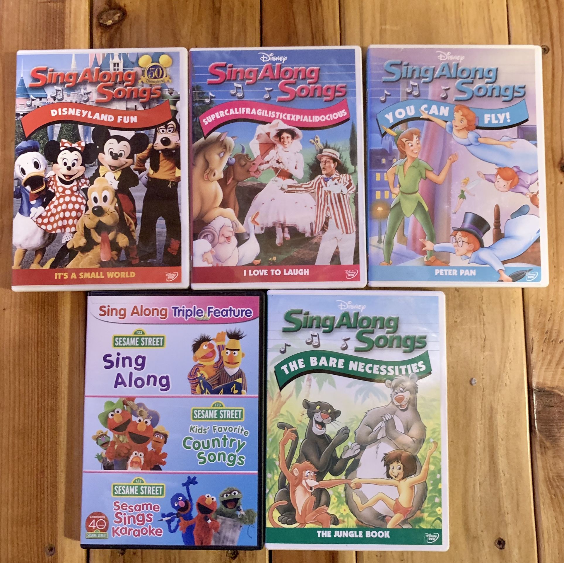 DVDs Of Four Assorted Disney Sing Along Songs & One Sesame Street ...