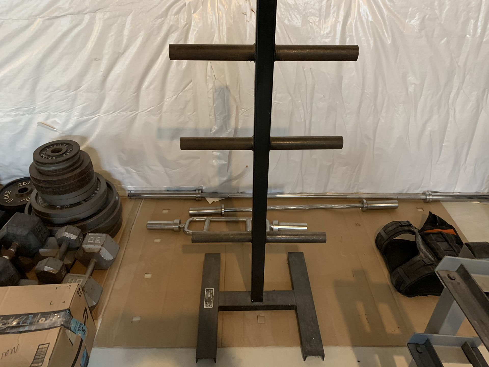 Rogue squat rack with dumbbells up to 80 lbs. bench press rack with bar ...